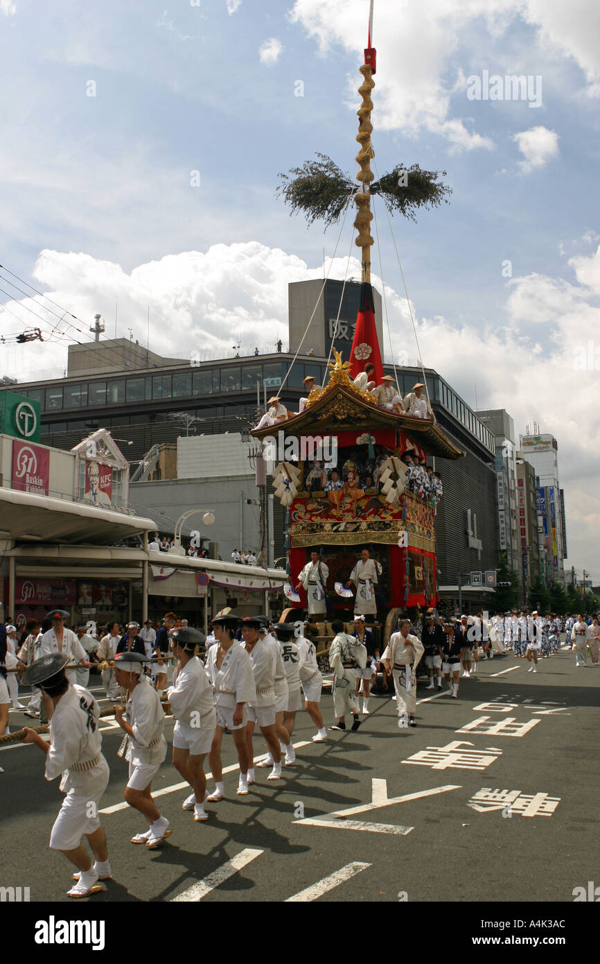 A Gion Matsuri festival float being pulled through the streets of ...