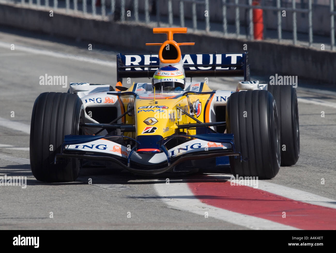 Giancarlo Fisichella ITA races his Renault R27 racecar down the track ...
