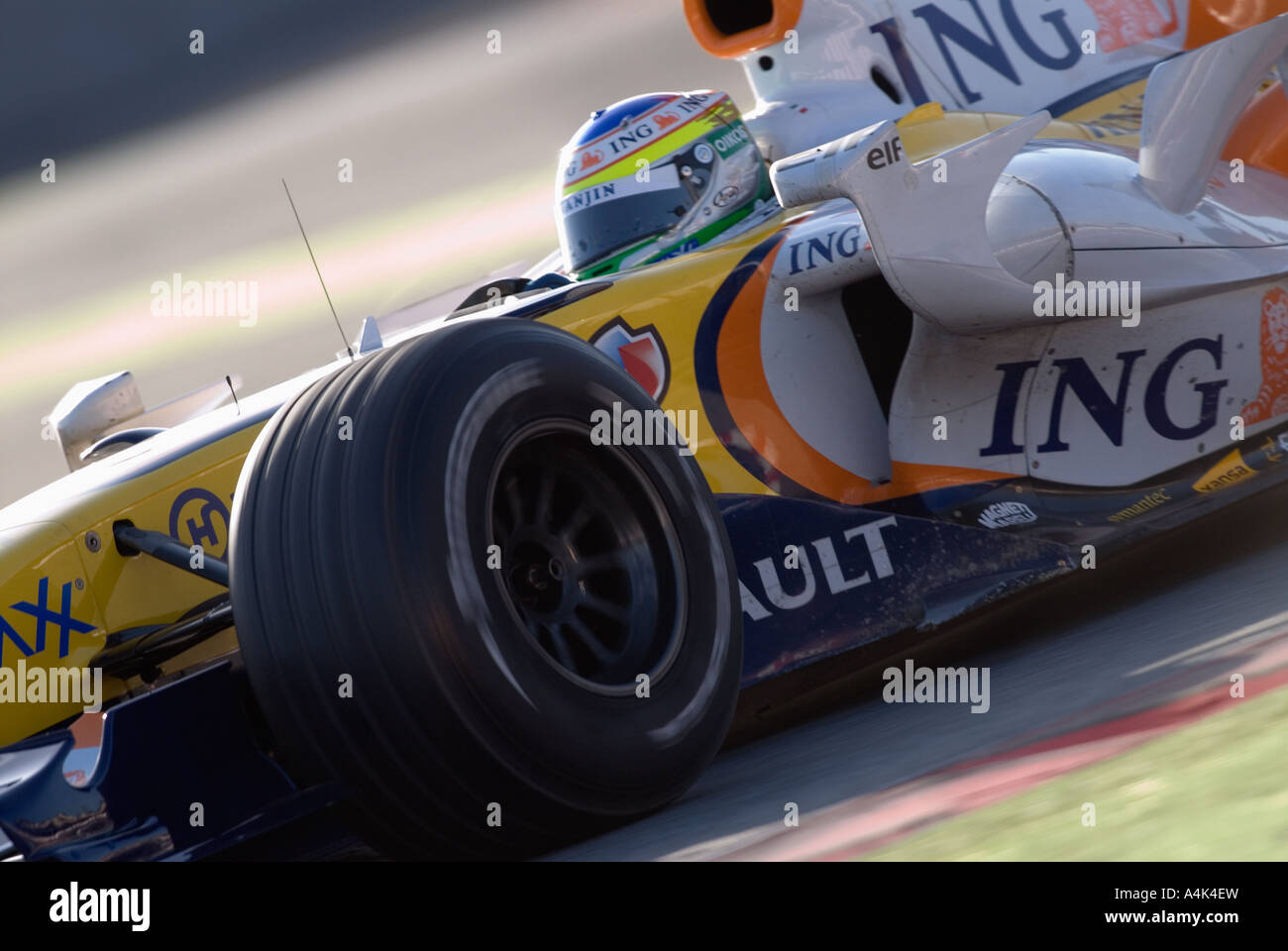 Giancarlo Fisichella ITA races his Renault R27 racecar down the track ...