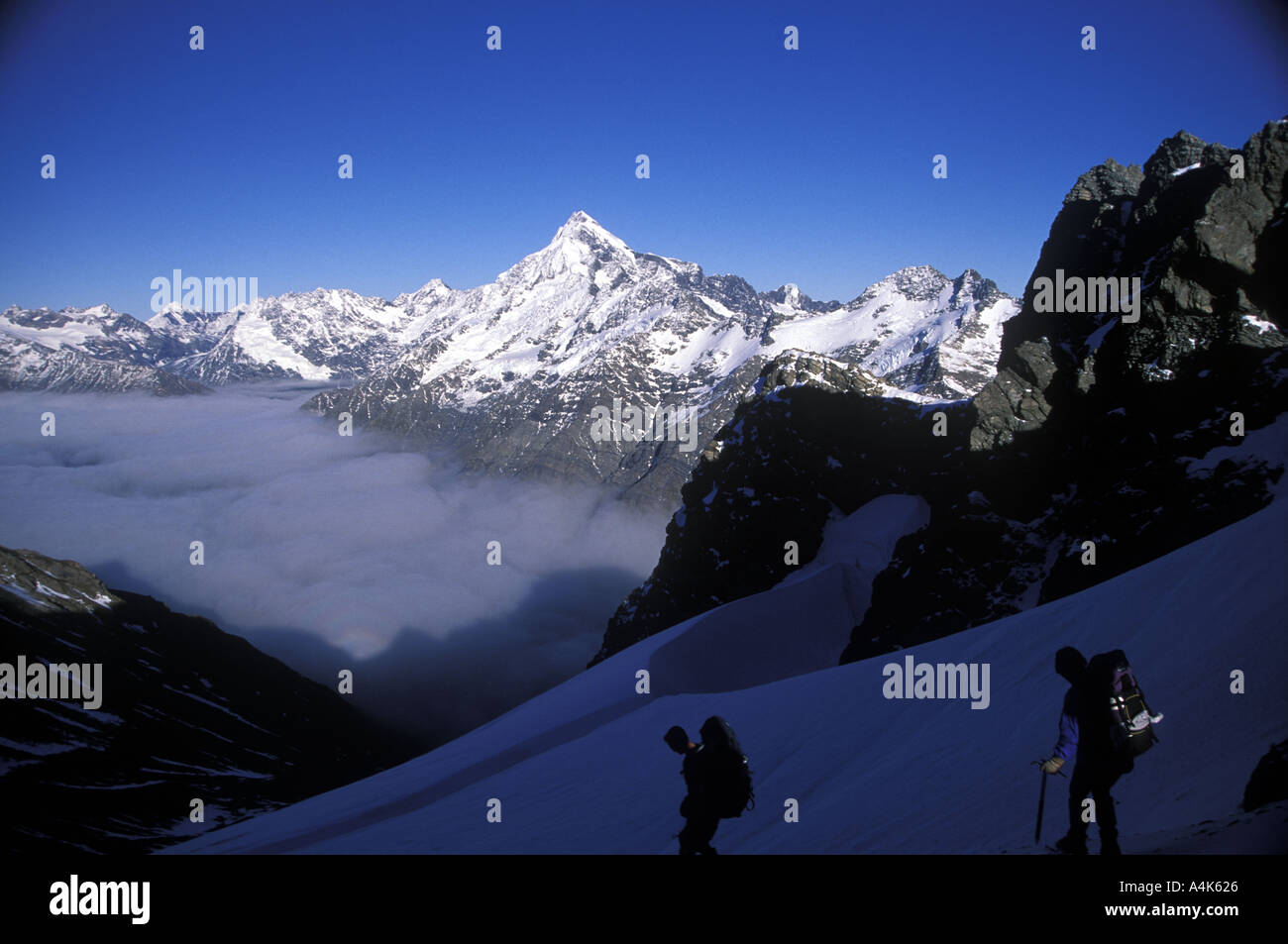 Hikers crossing Ball Pass with view of Mt Sefton Aoraki Mount Cook ...