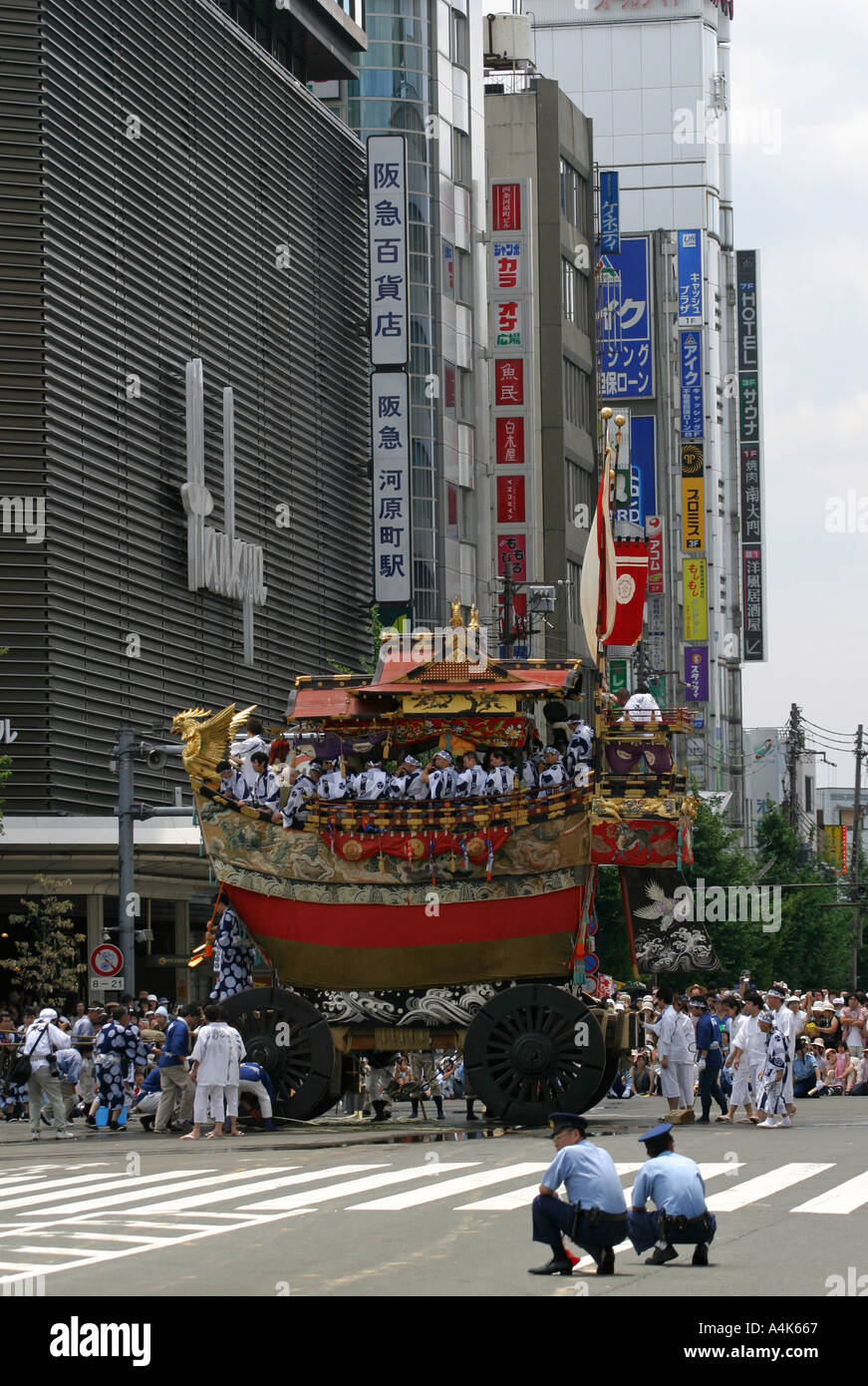 A boat shaped float is pulled during the main parade at the Gion ...