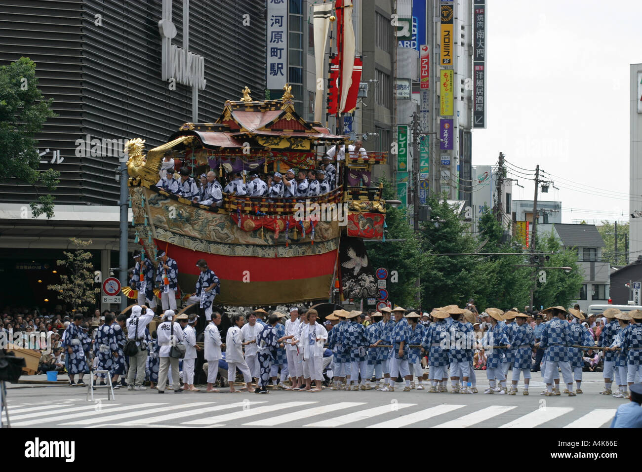 A boat shaped float is pulled during the main parade at the Gion ...