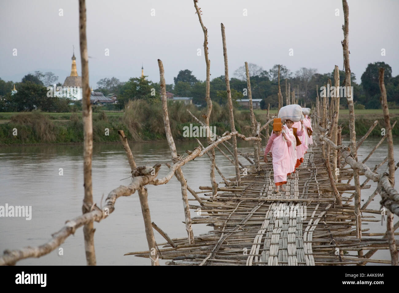 Young Nuns on Bamboobridge, Bamaw, Bhamo, Myanmar Stock Photo - Alamy
