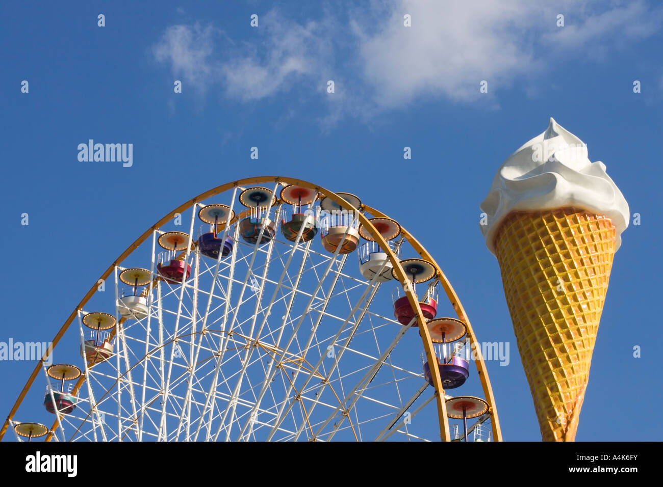 Giant ice cream cone in front of a ferris wheel at the Vincennes fair ...