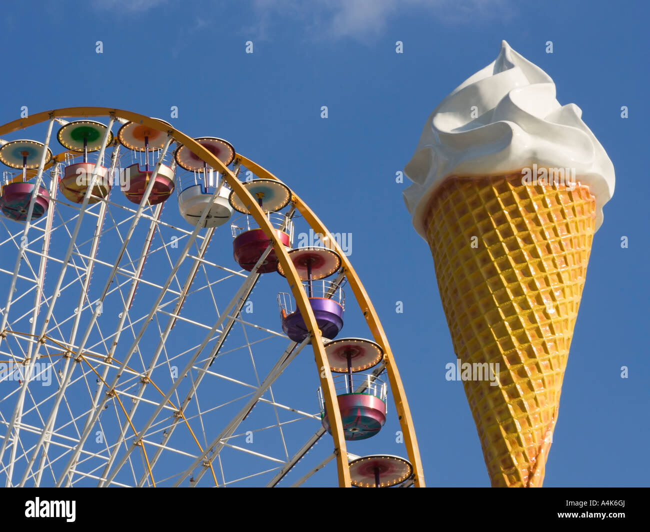 Giant ice cream cone in front of a ferris wheel at the Vincennes fair ...