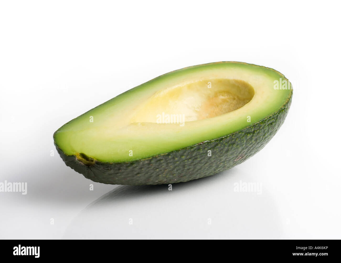 Side view of an avocado half with reflection isolated on a white ...