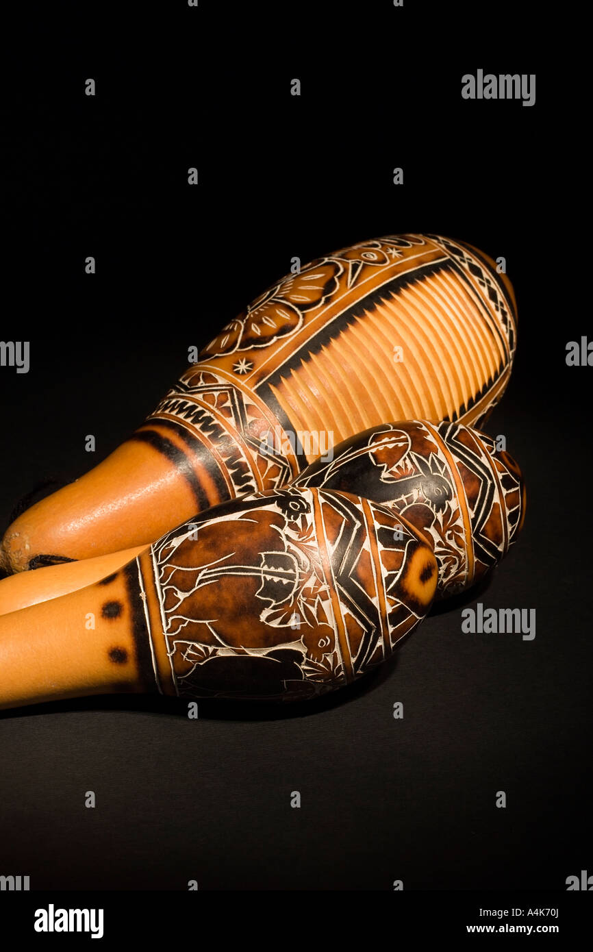 A pair of handmade peruvian maracas isolated on a black background ...
