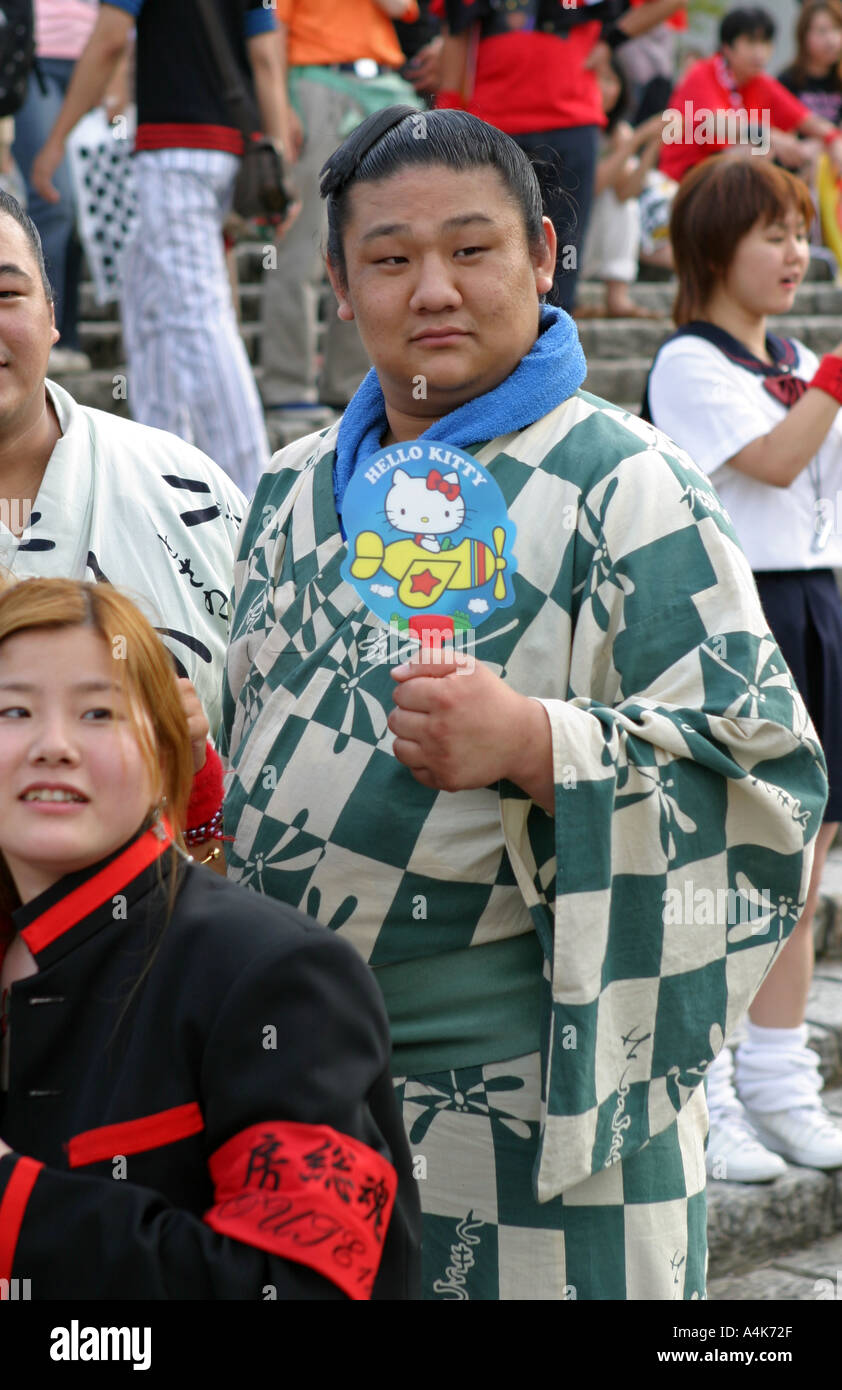 Sumo wrestlers in summer yukata kimono attend a pop concert in central ...