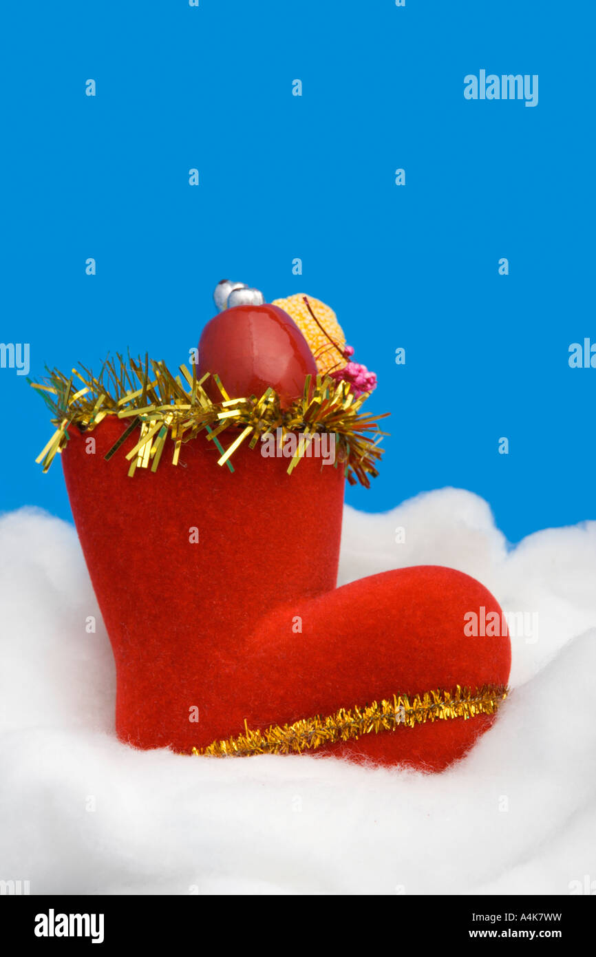Decorated Santa s boot lying on a bed of cotton Stock Photo - Alamy