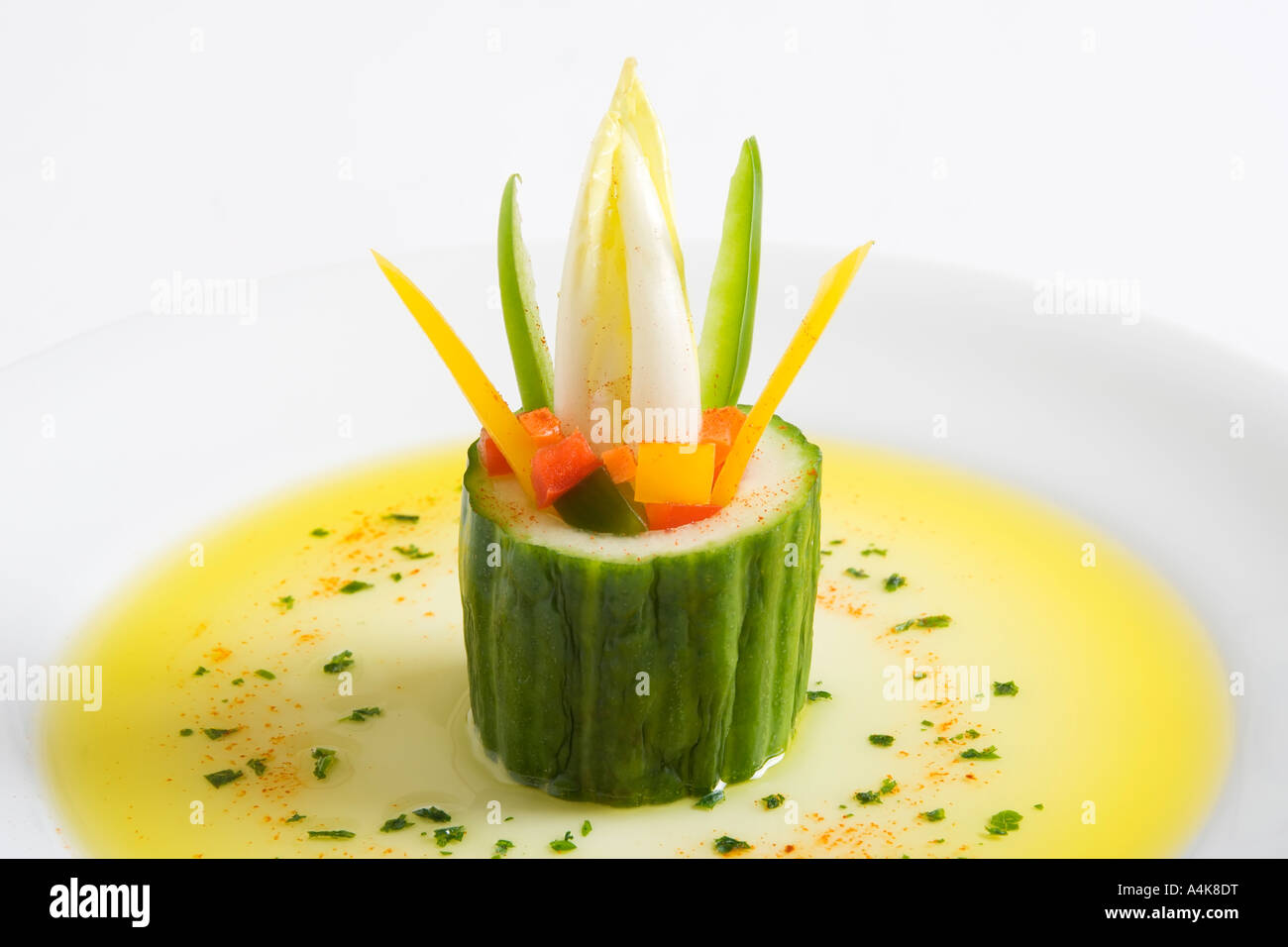 A cucumber vegetarian starter with olive oil on a white plate Stock ...
