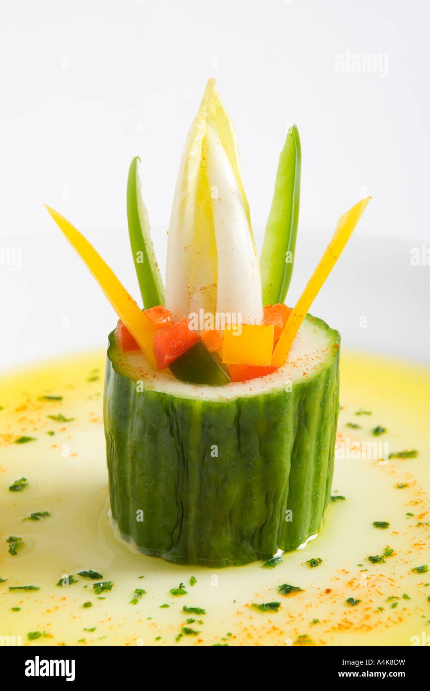 A cucumber vegetarian starter with olive oil on a white plate Stock ...