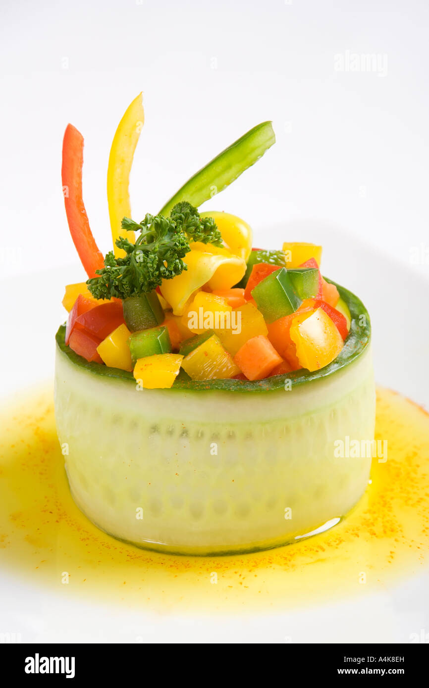 A cucumber vegetarian starter with olive oil on a white plate Stock ...