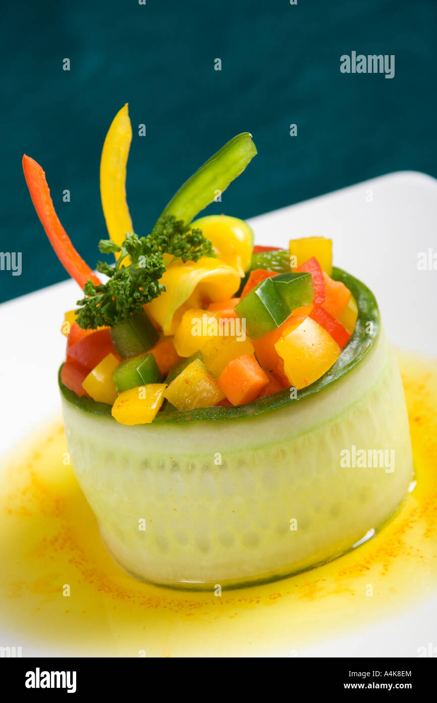 A cucumber vegetarian starter with olive oil on a white plate Stock ...