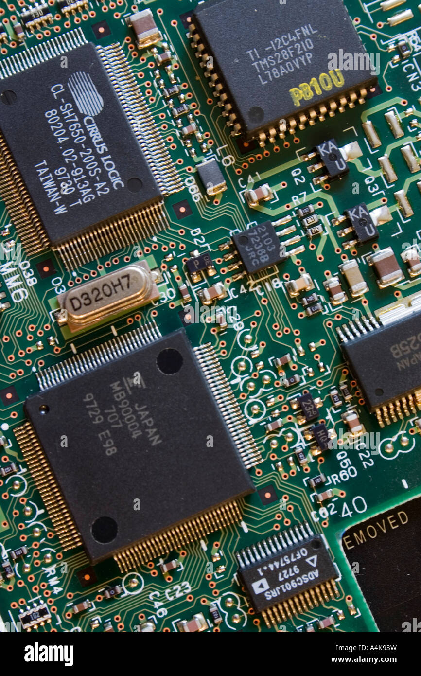 Silicone chips and electrical components on a printed circuit board ...