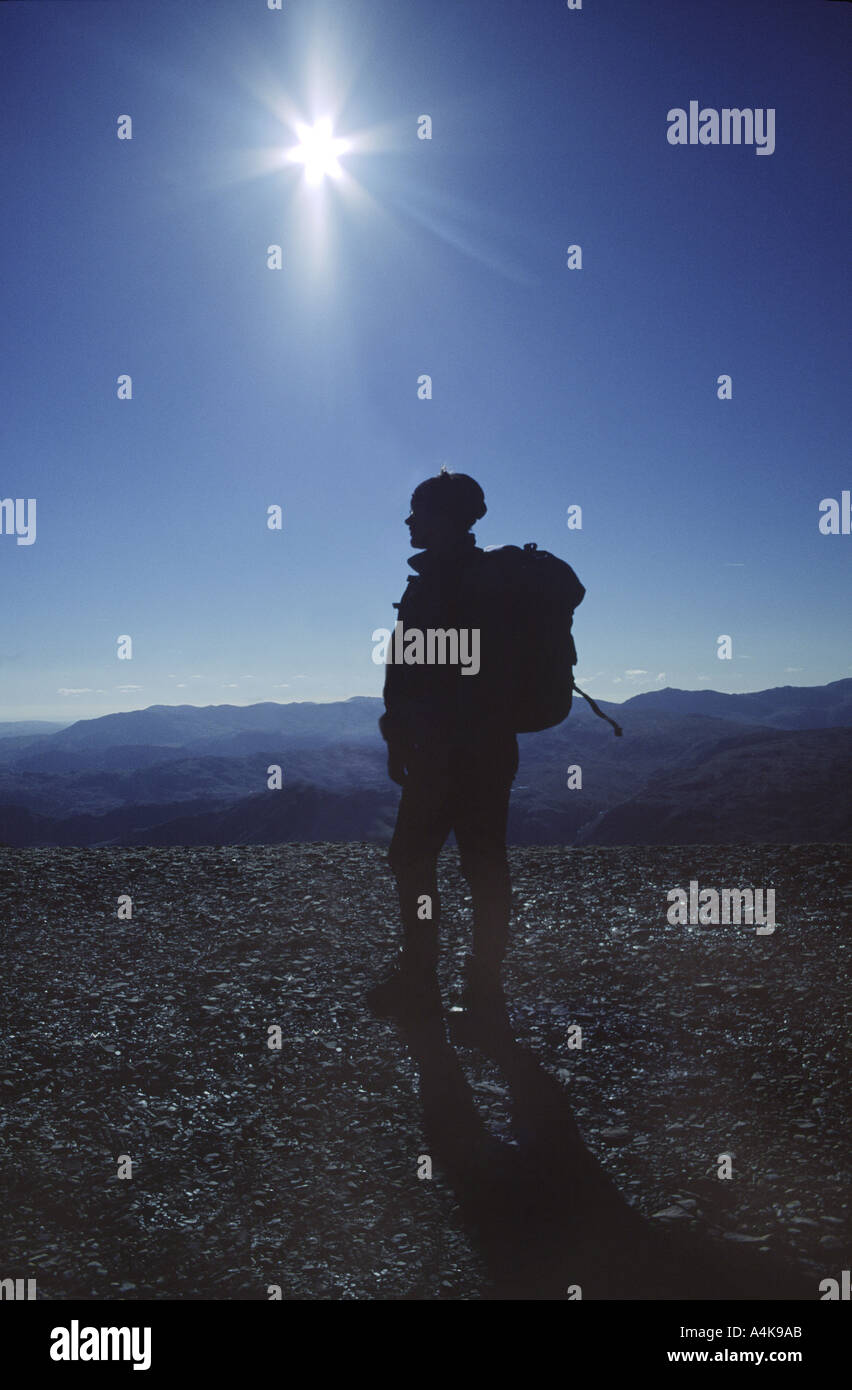 Hiker in sun on Helvellyn Lake District UK Stock Photo - Alamy