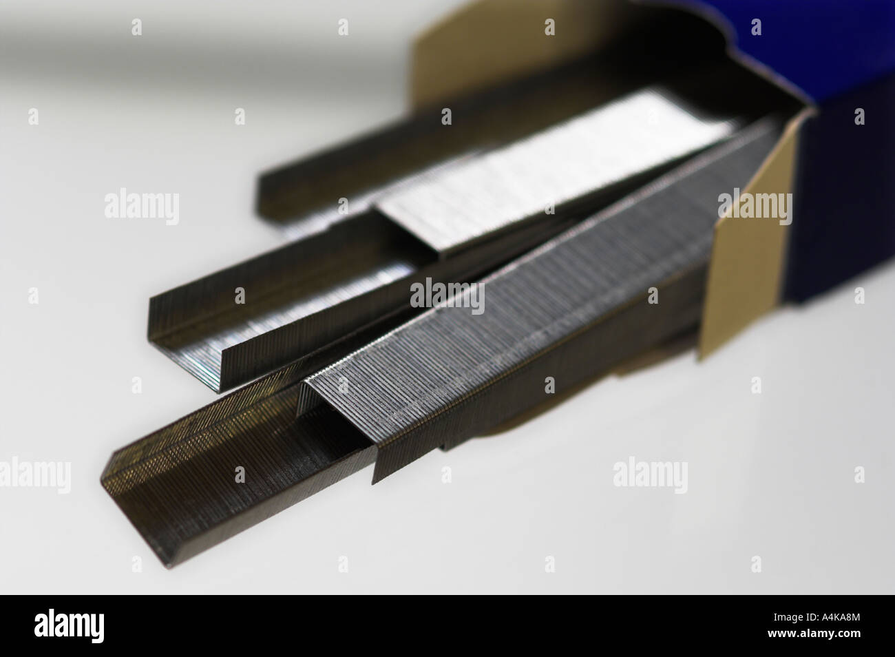 Staples spilling out of box Stock Photo - Alamy