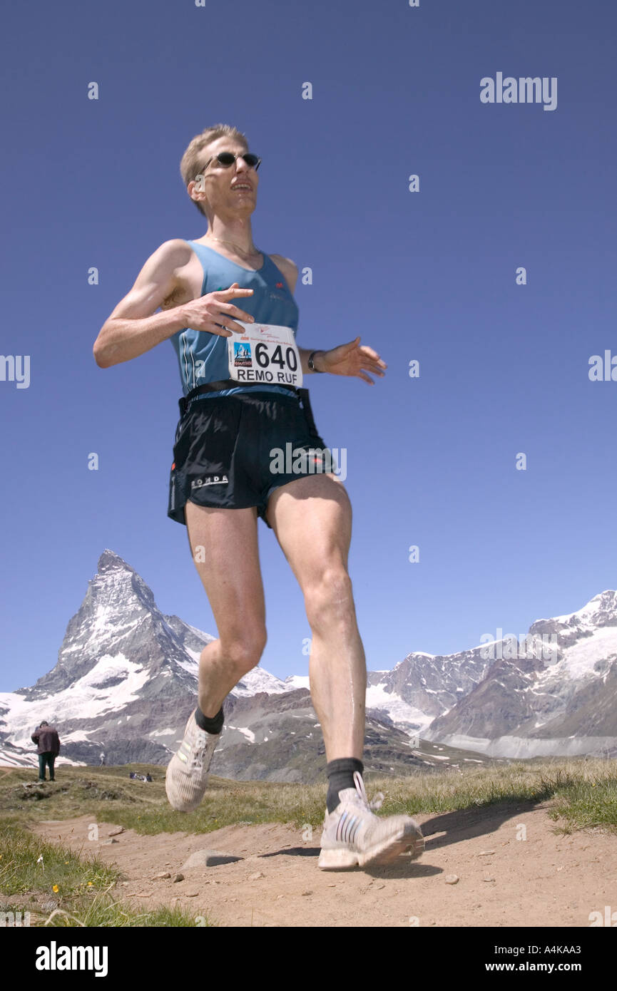 runner in front of the Matterhorn in the Zermatt Marathon Stock Photo ...
