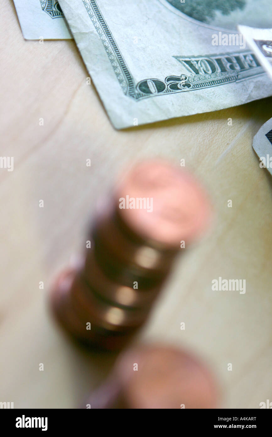 Coins bills and pennies on wooden table Stock Photo - Alamy