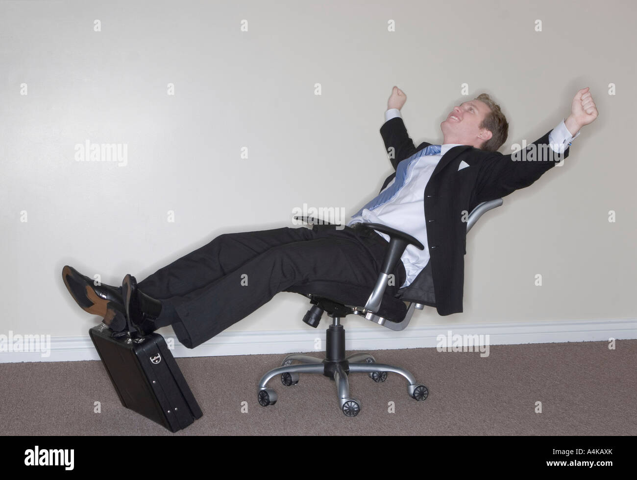 Man sitting on chair backwards hi-res stock photography and images - Alamy