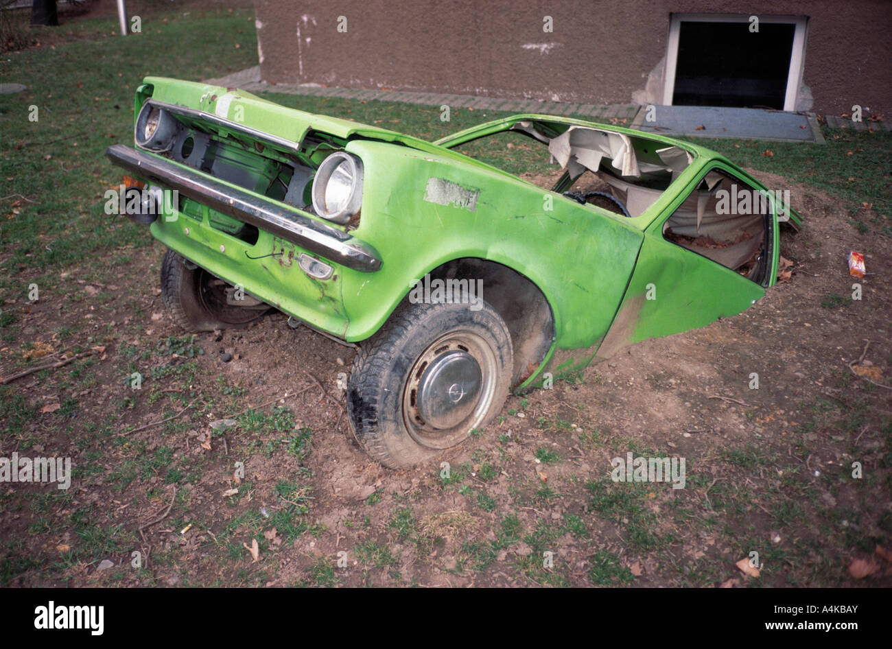 A buried car which is part of a spoof of pupils leaving school in ...