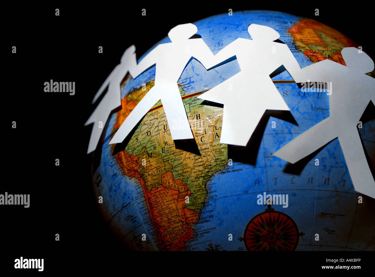 man and woman cut out figures circle globe Stock Photo - Alamy