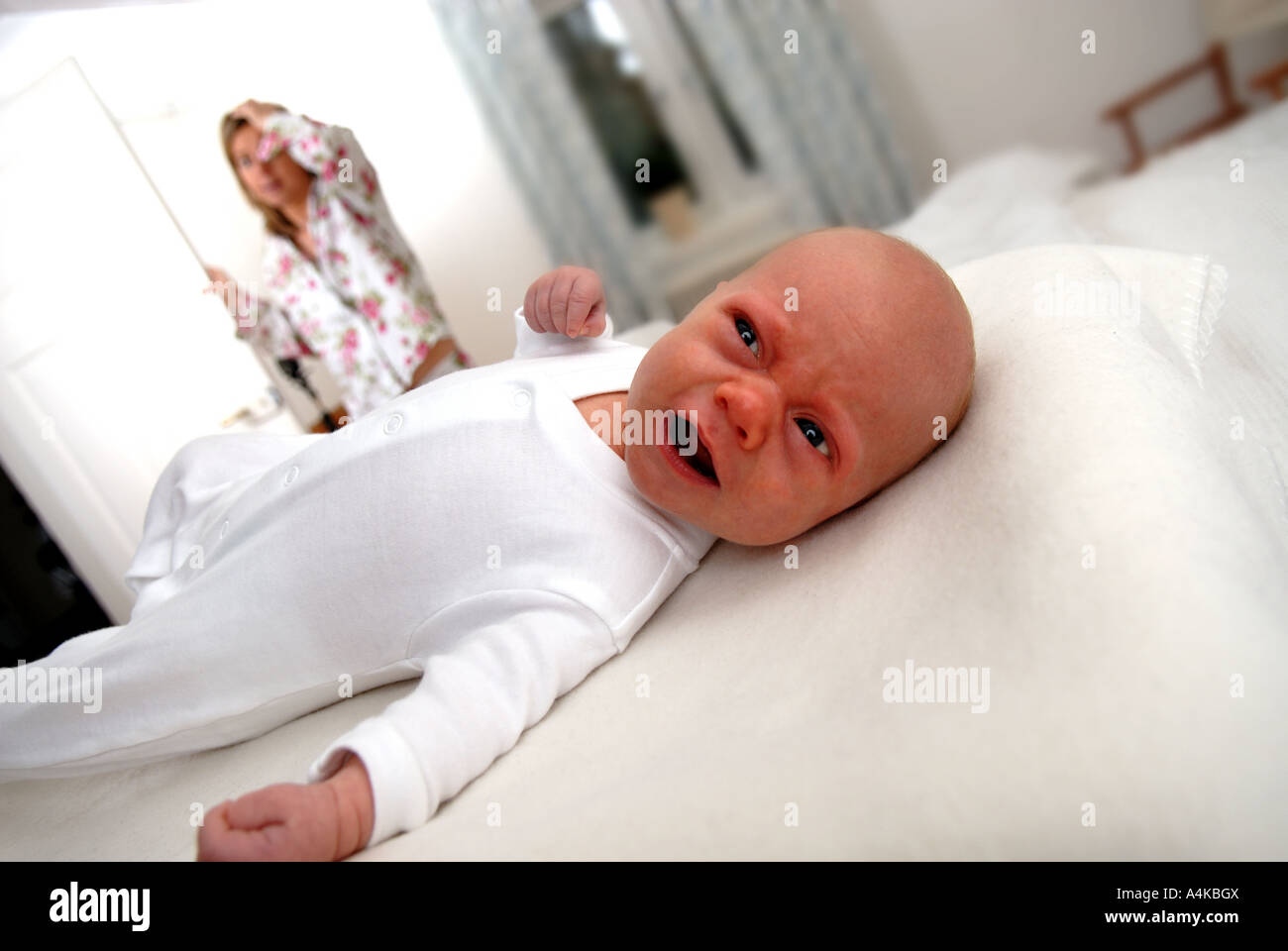 woman in desperate state with screaming baby newborn Stock Photo - Alamy