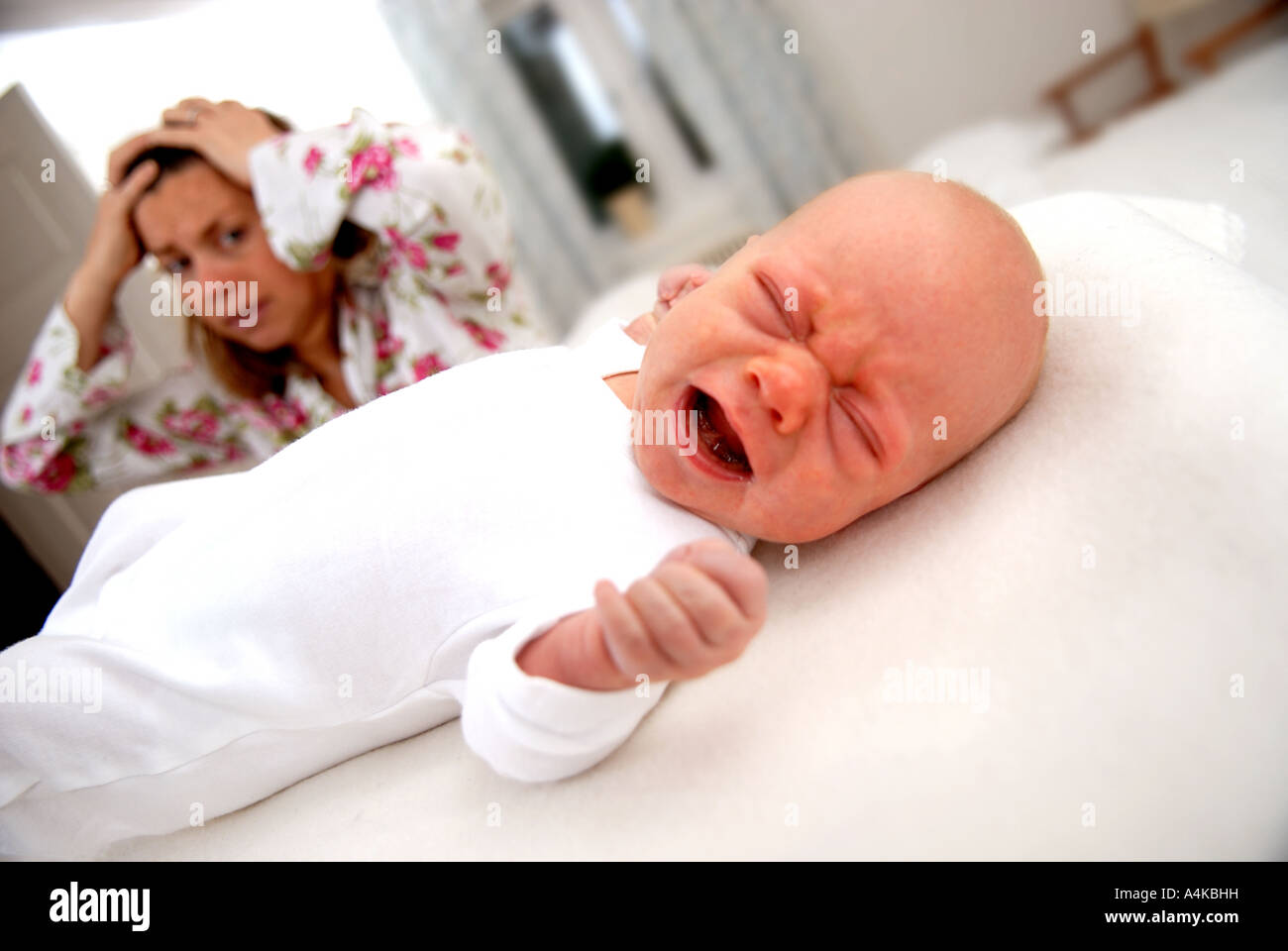 woman in desperate state with screaming baby newborn Stock Photo - Alamy