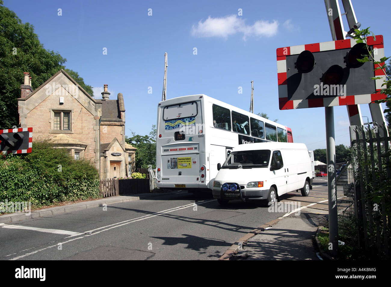 3rd August 2006. Level crossing. Crossing lights and old crossing house ...