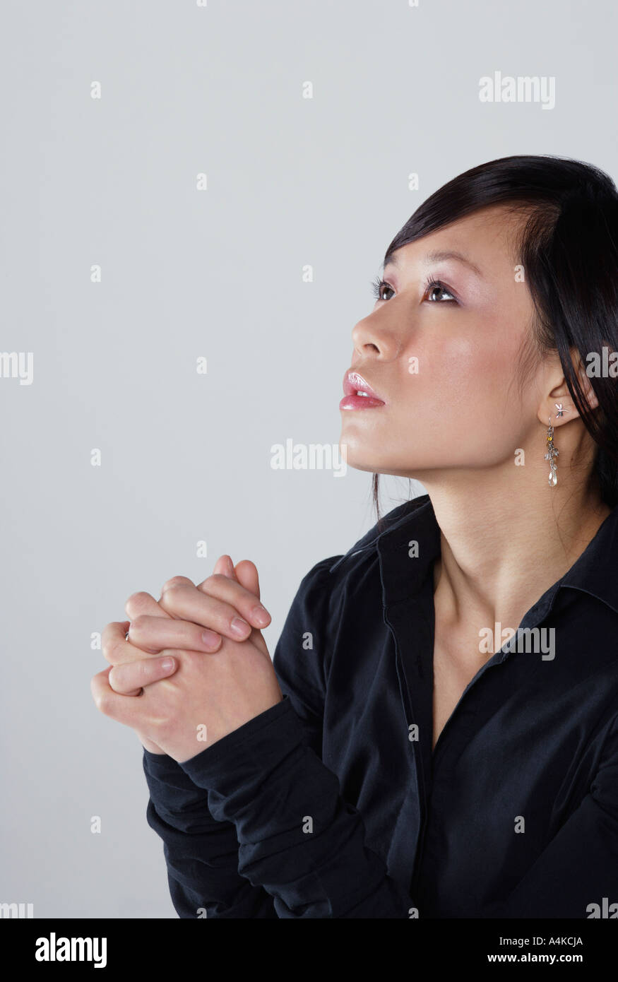 Woman praying alone hi-res stock photography and images - Alamy