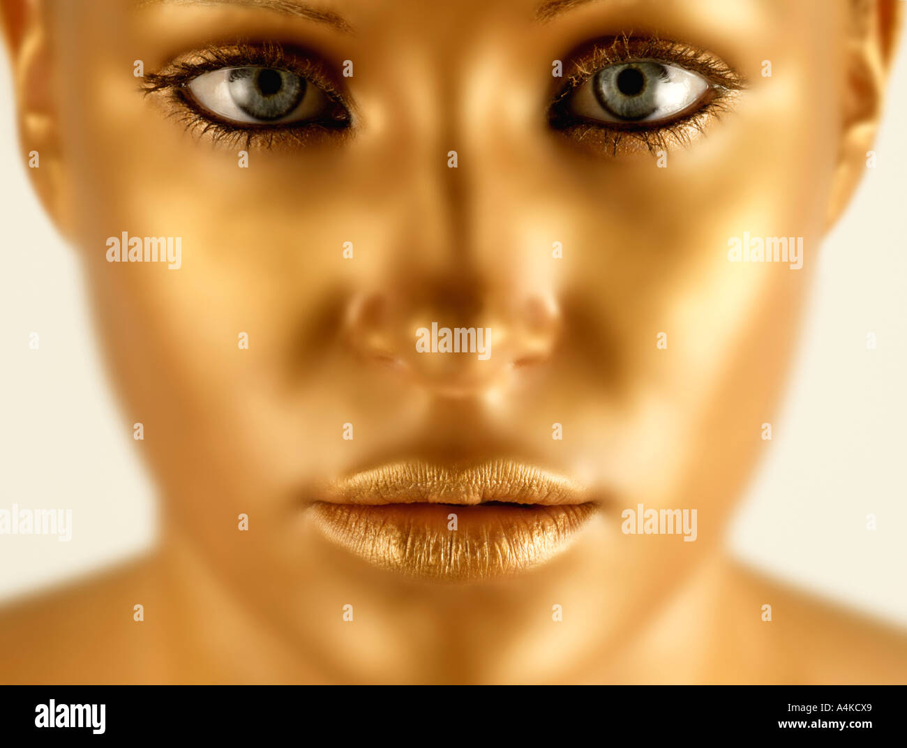 Gold face paint hi-res stock photography and images - Alamy