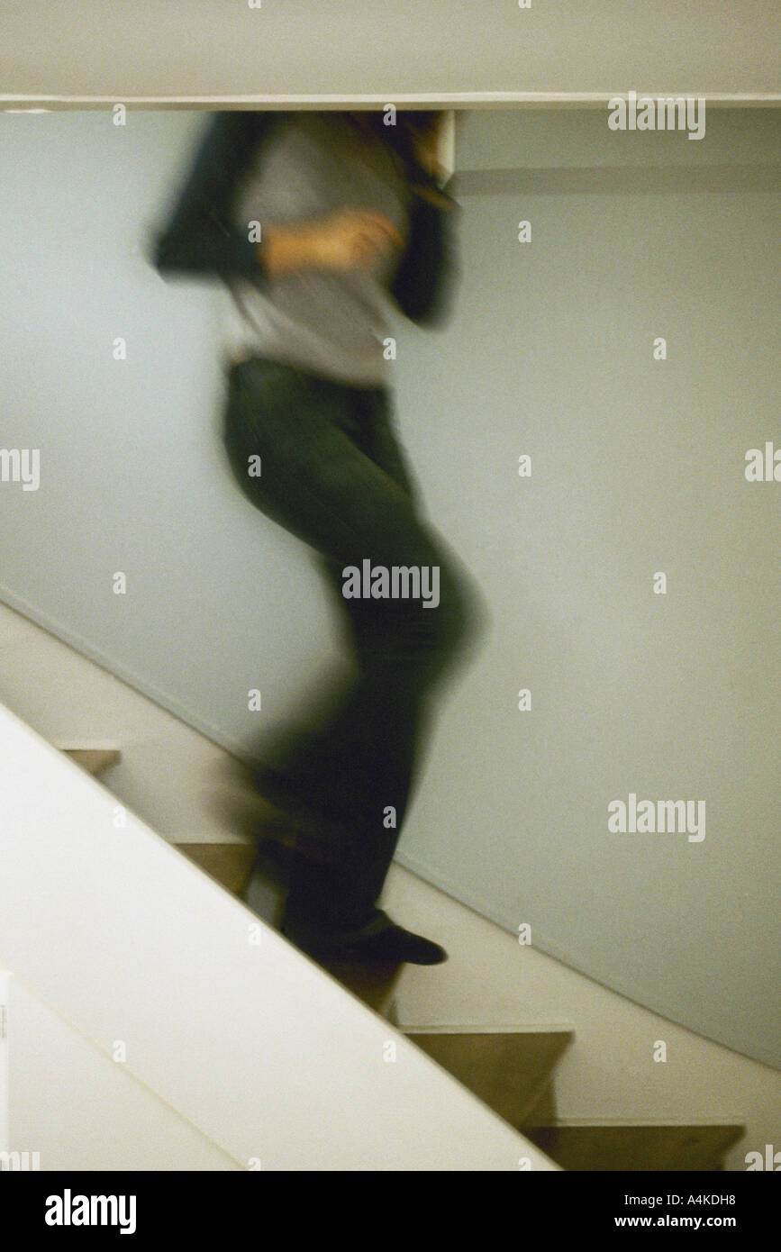 Person walking down stairs Stock Photo - Alamy