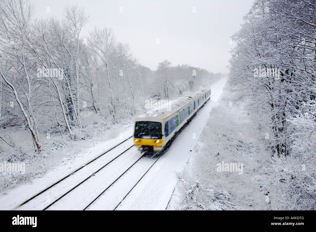 Branch Line Passenger Train Approaching Between Snow Covered Trees ...