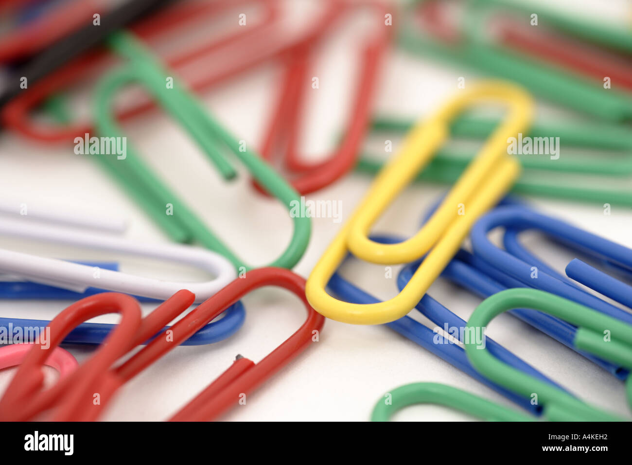 Yellow paper clip Stock Photo - Alamy