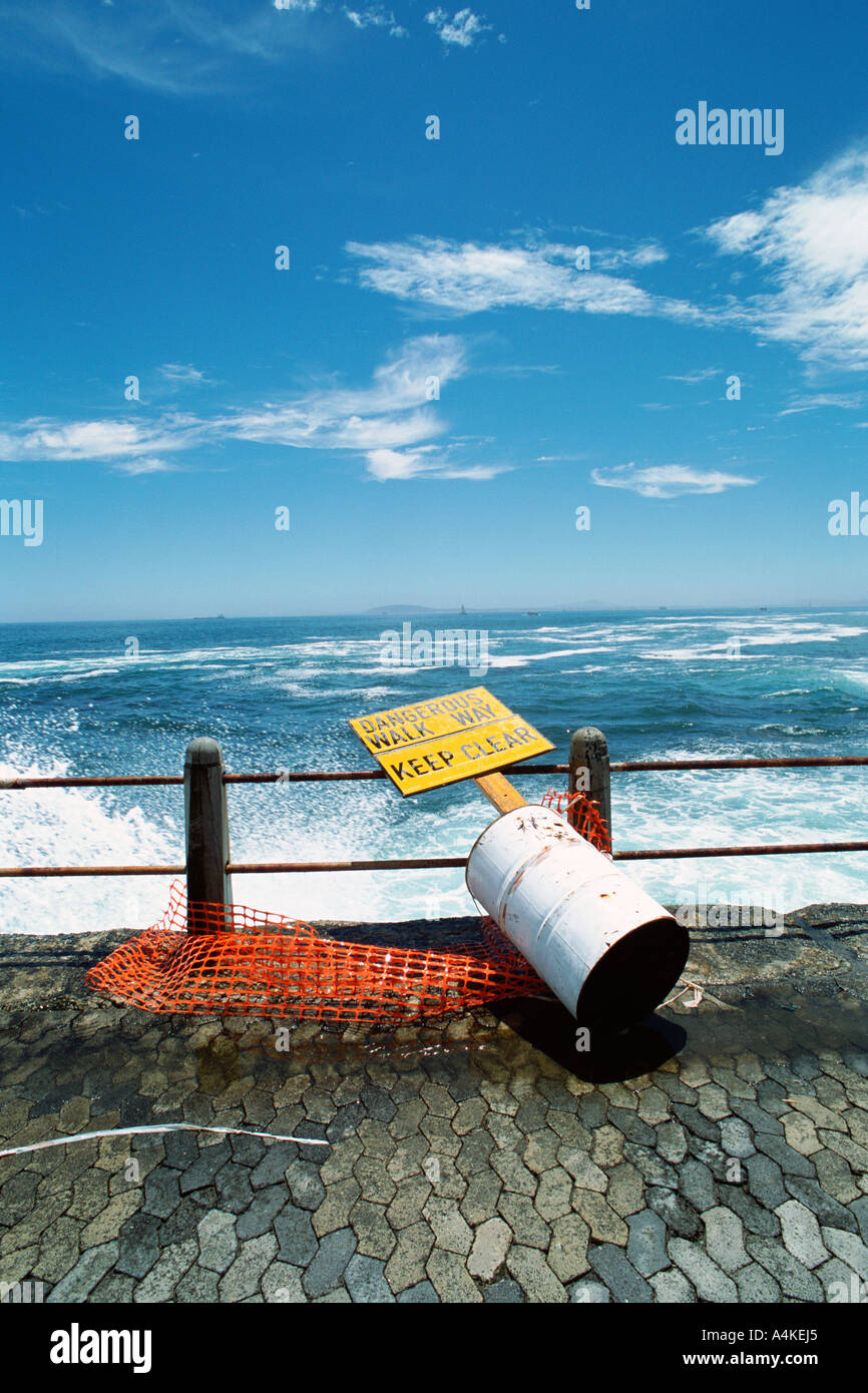 Pier with fallen warning sign Stock Photo - Alamy