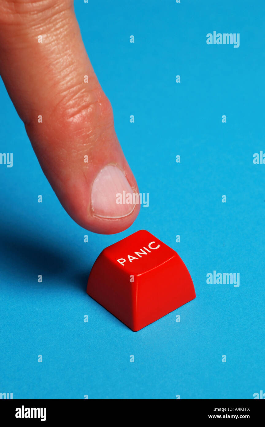 Panic button: finger pushing red panic button Stock Photo - Alamy