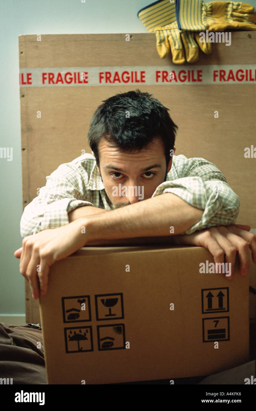 Man with cardboard boxes Stock Photo - Alamy