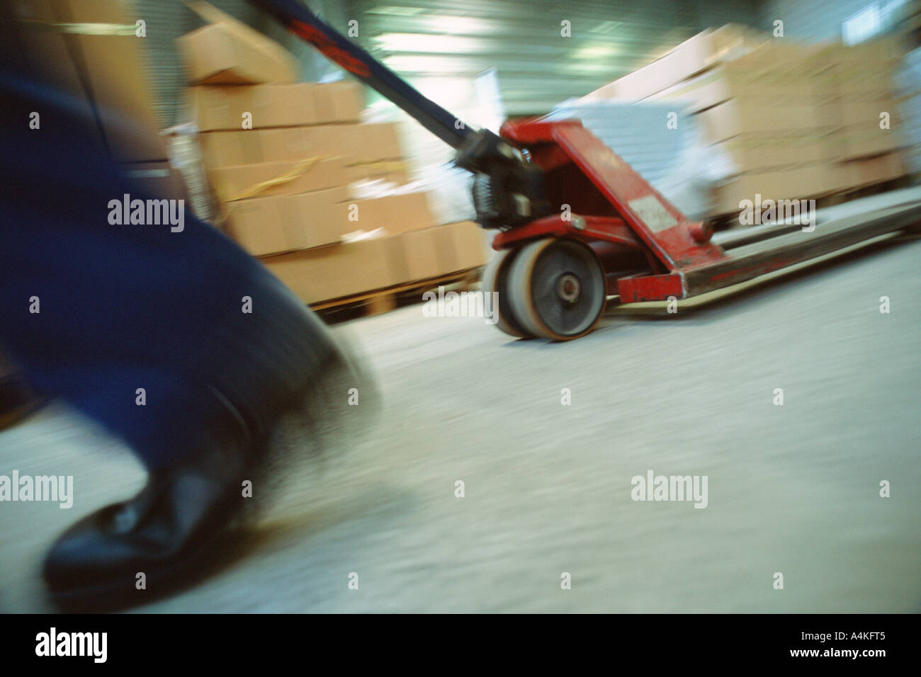 Warehouse pulling pallet truck boxes hi-res stock photography and ...
