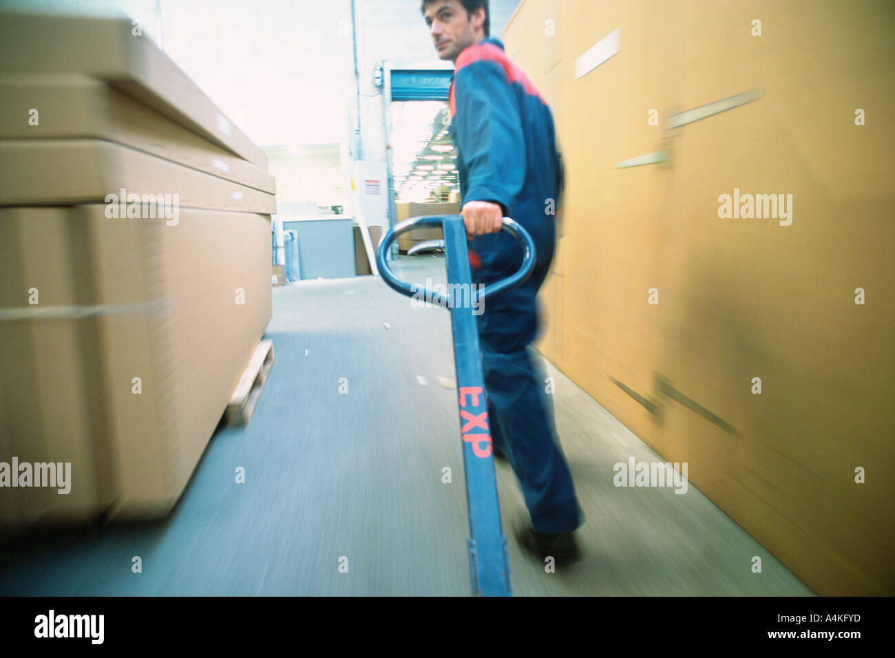 Warehouse pulling pallet truck boxes hi-res stock photography and ...