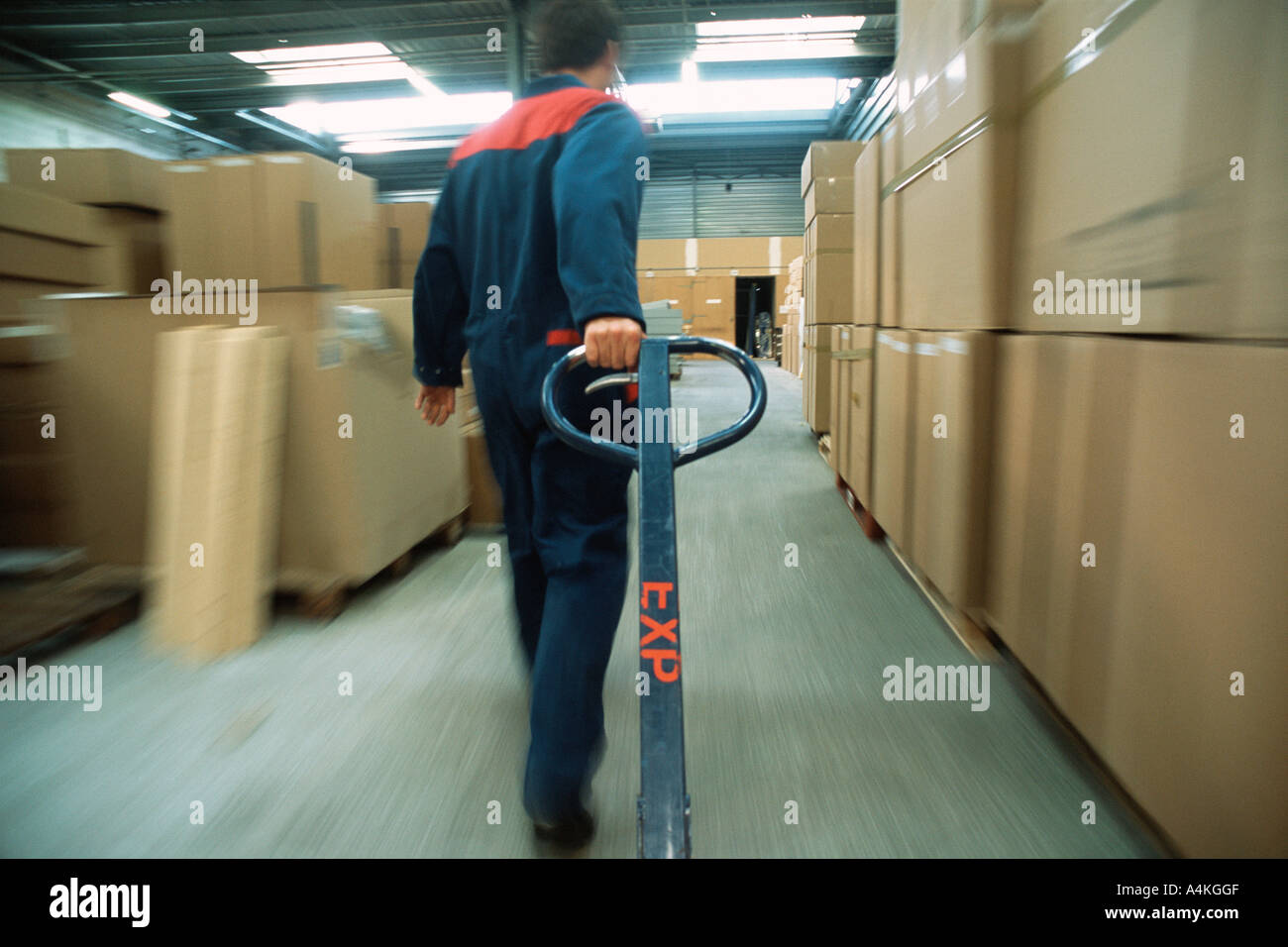Warehouse pulling pallet truck boxes hi-res stock photography and ...
