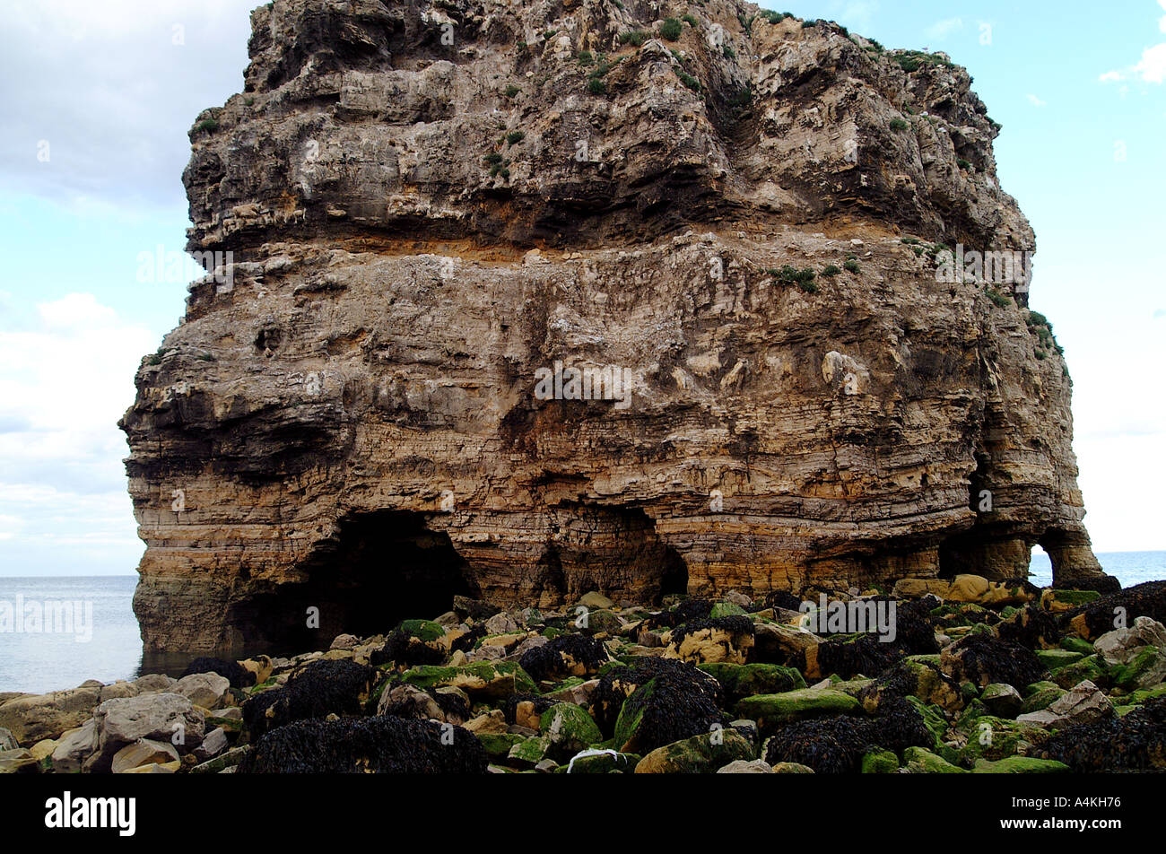 Rock outpost on shore Stock Photo - Alamy