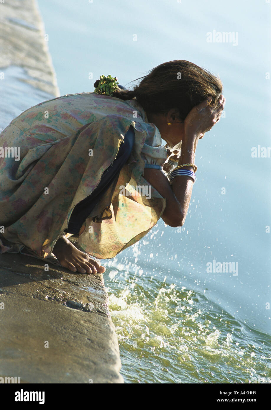 India, Sarkej, girl washing face by river Stock Photo - Alamy