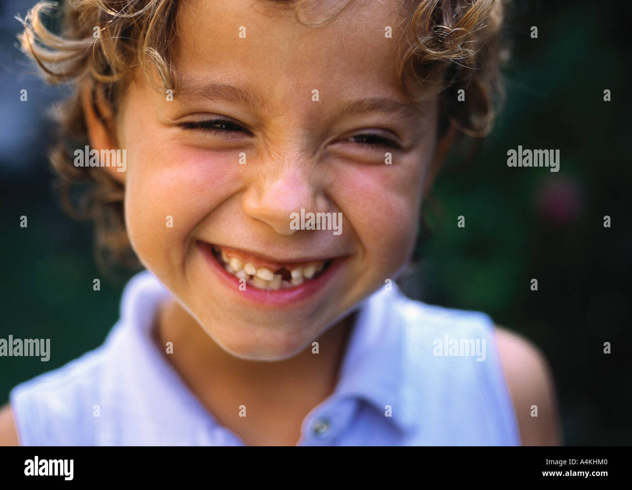 Girl with missing tooth smiling Stock Photo - Alamy