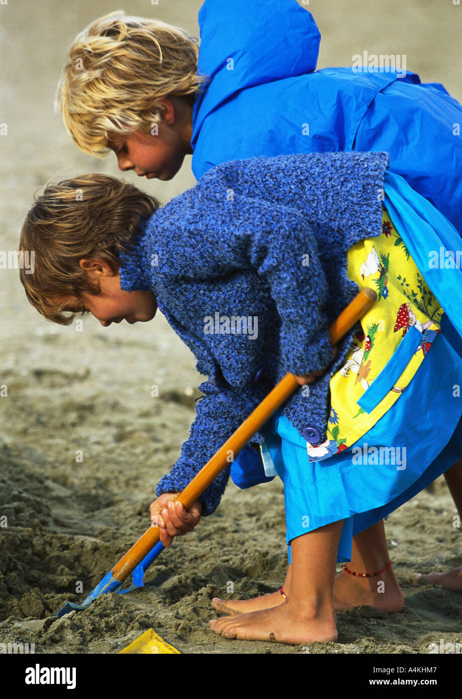 Children Digging In Sand High Resolution Stock Photography and Images ...