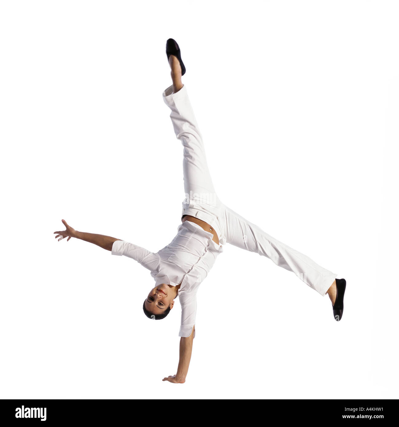 Woman turning cartwheel Stock Photo - Alamy