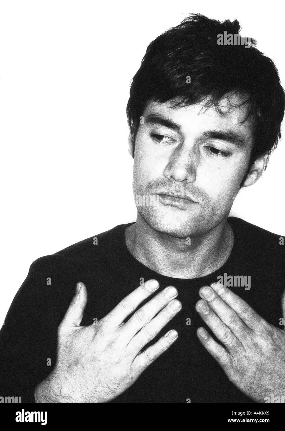 Man, hands on chest, portrait Stock Photo - Alamy