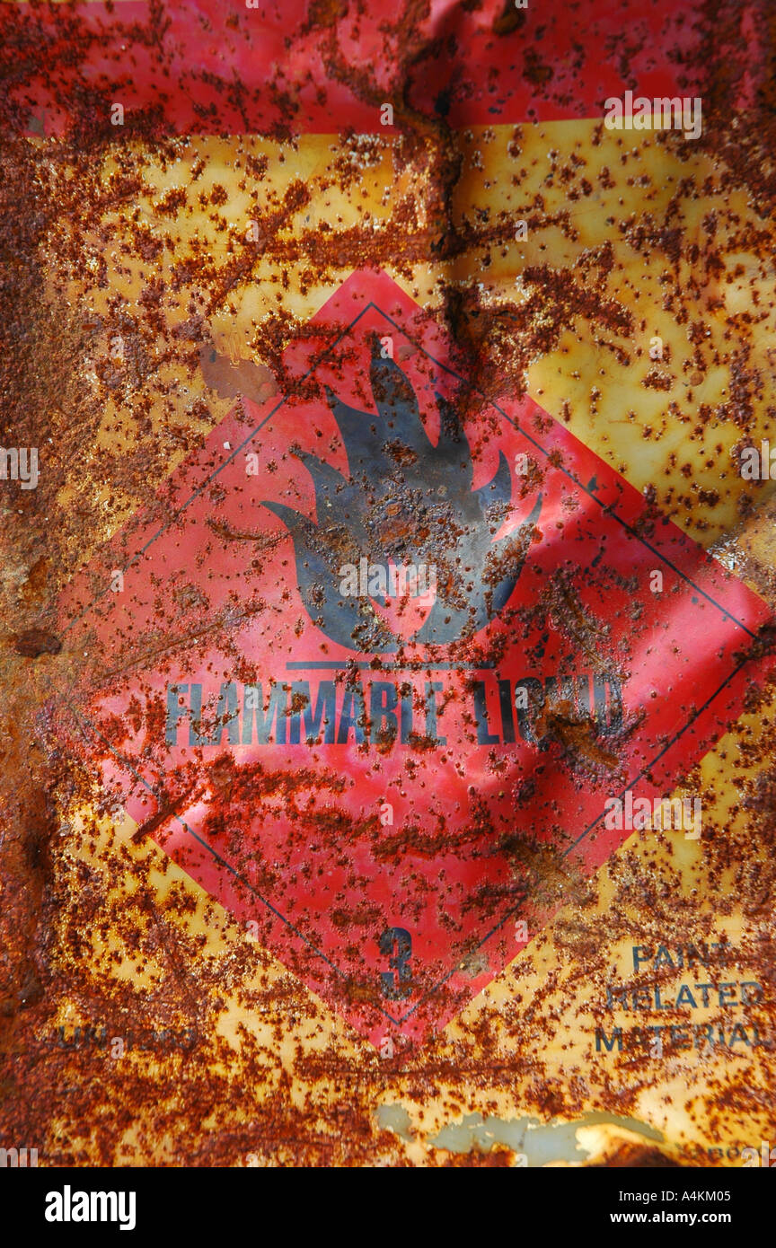 Flammable logo symbol on a washed up container Stock Photo - Alamy