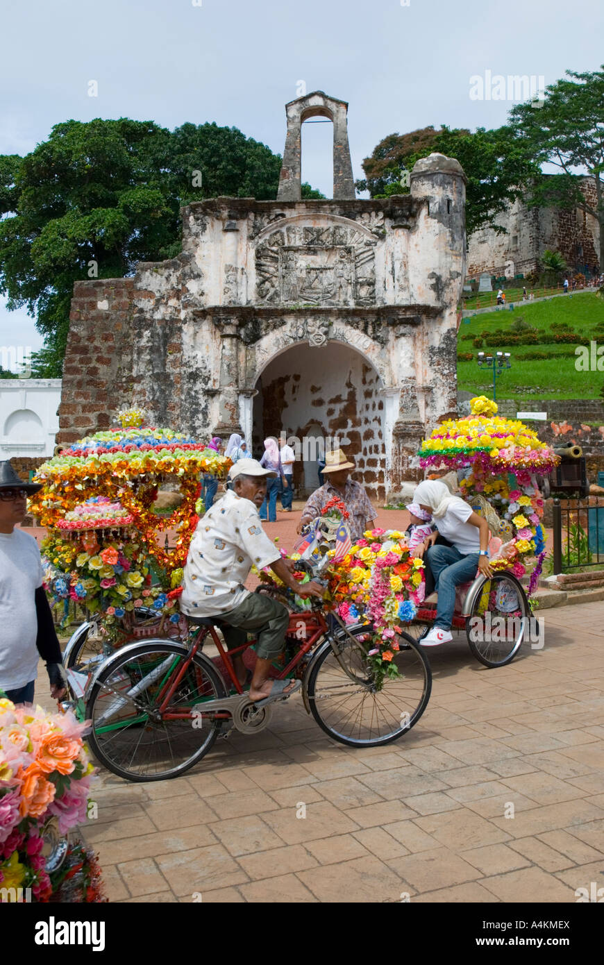 Colourfully decorated trishaws outside the a famosa Portugese fort in ...