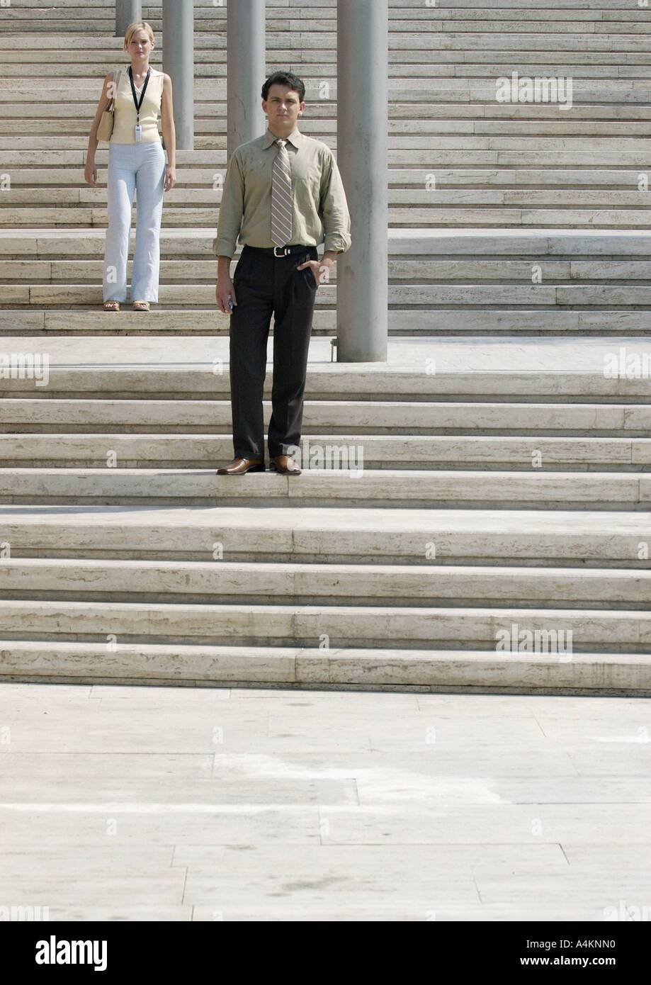 Young woman standing stairs hi-res stock photography and images - Alamy