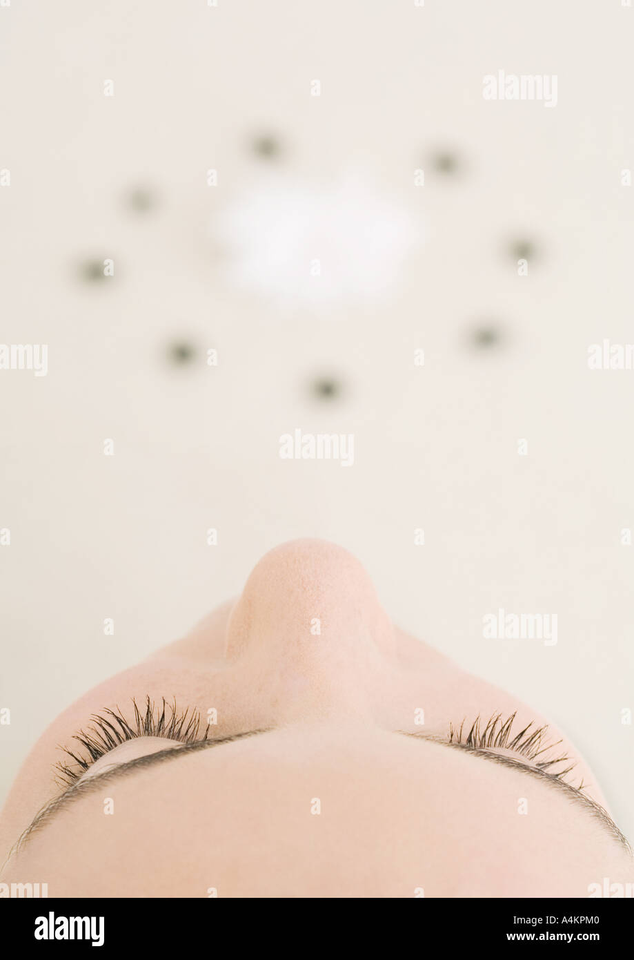 Woman's face, high angle view, and circle in blurred background Stock ...