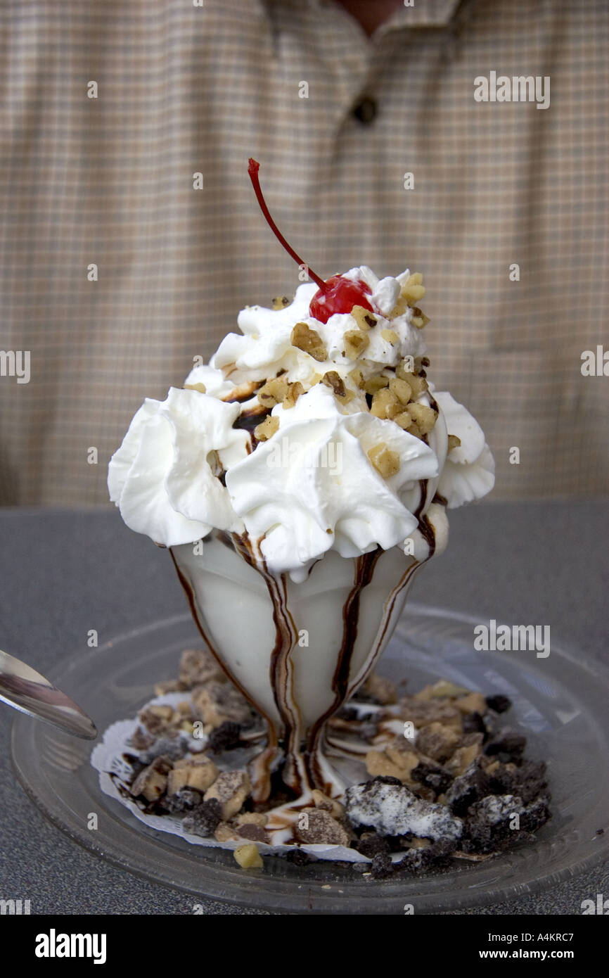 Chocolate sundae with whipped cream and cherry topping Stock Photo - Alamy